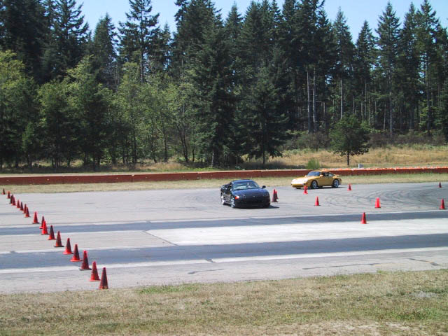 closer to the apex this time, and I've got a Porsche on my tail!